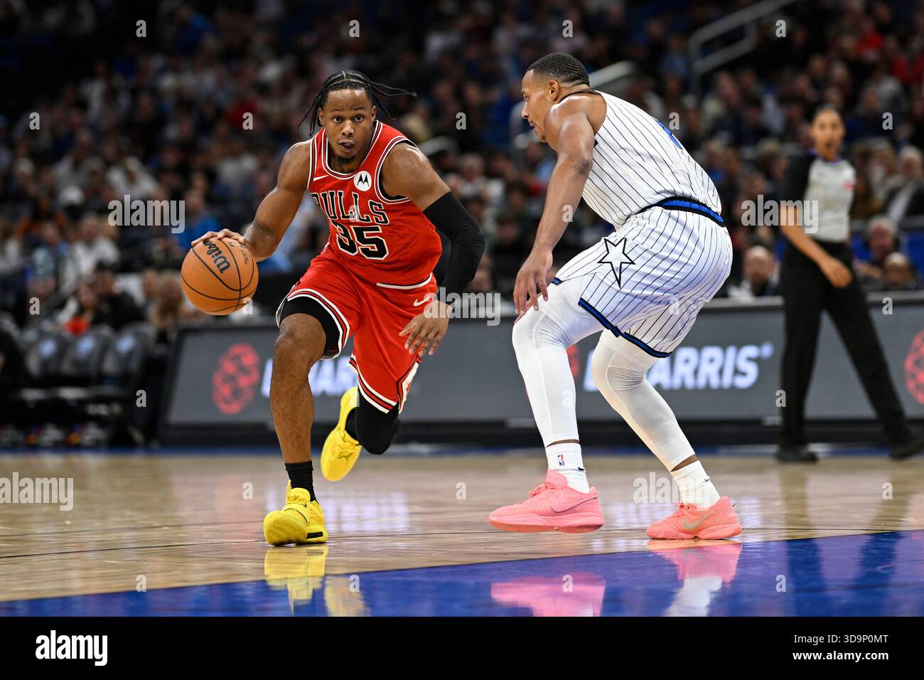 Chicago Bulls forward Isaac Okoro (35) is defended by Orlando Magic ...