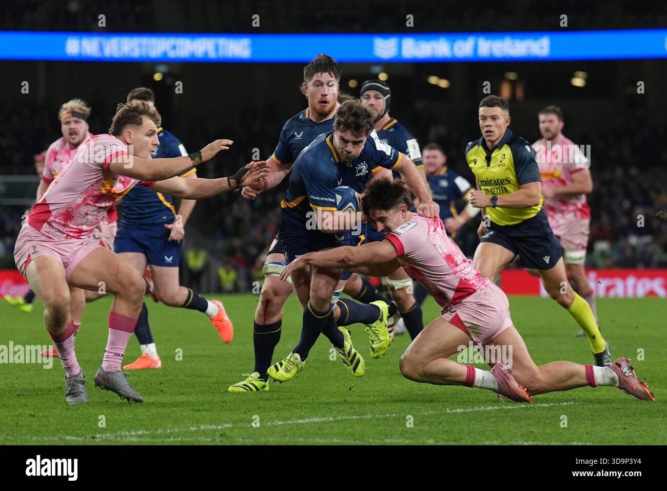 Leinster’s Luke McGrath (centre) is tackled by Harlequins's Cadan ...