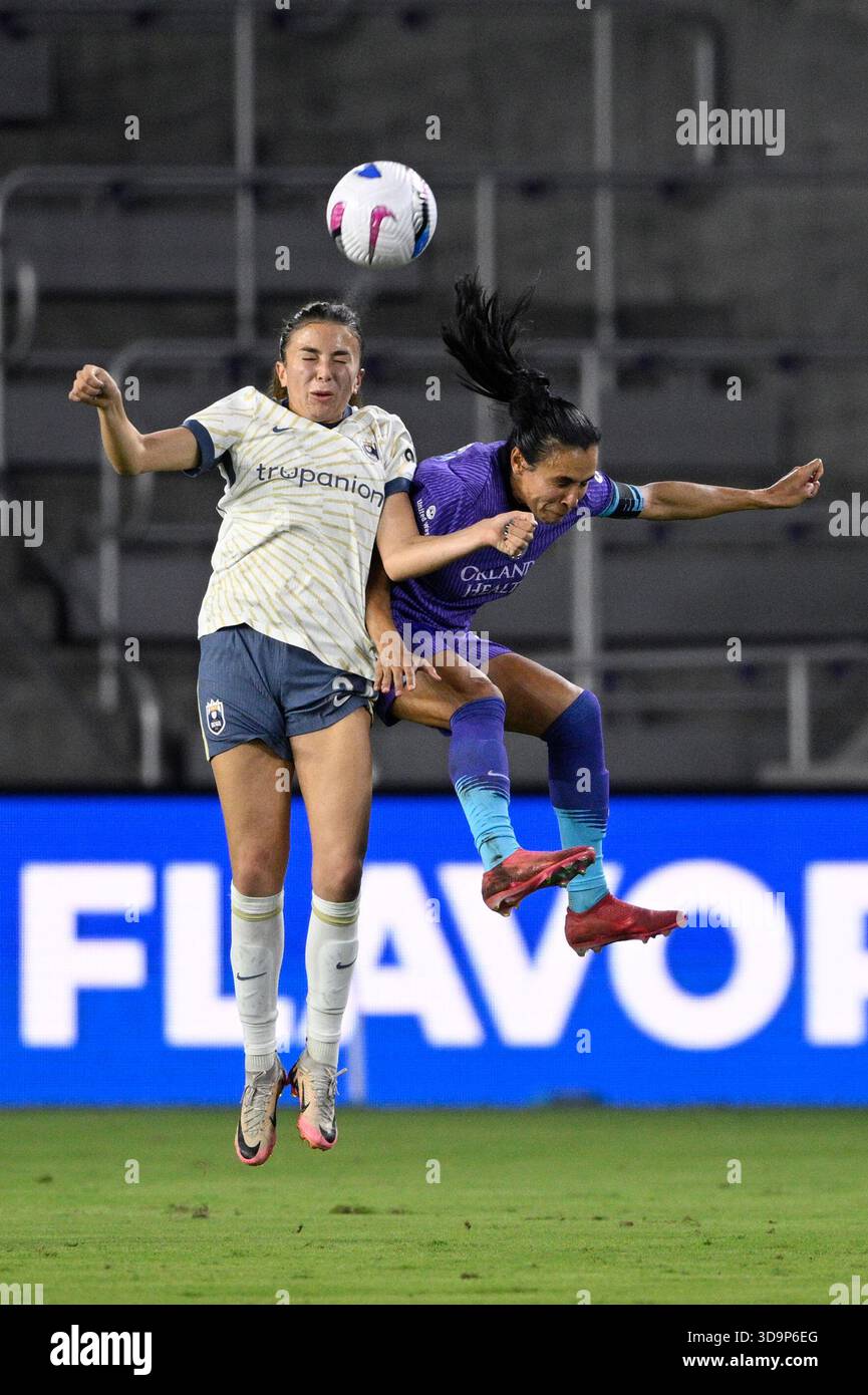 Seattle Reign FC's Madison Curry, left, and Orlando Pride forward Marta ...