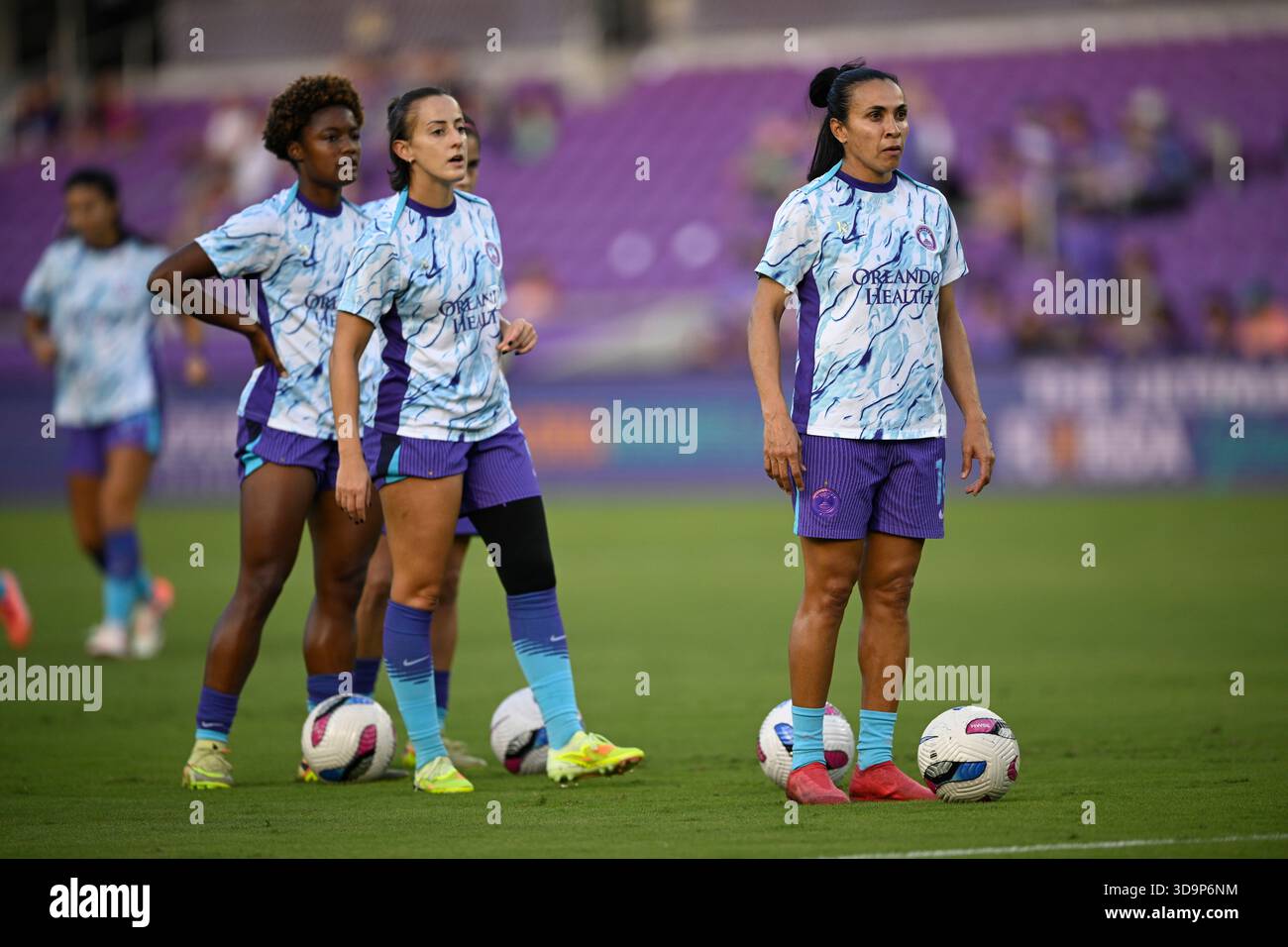 Orlando Pride forward Marta, right, warms up before an NWSL soccer ...