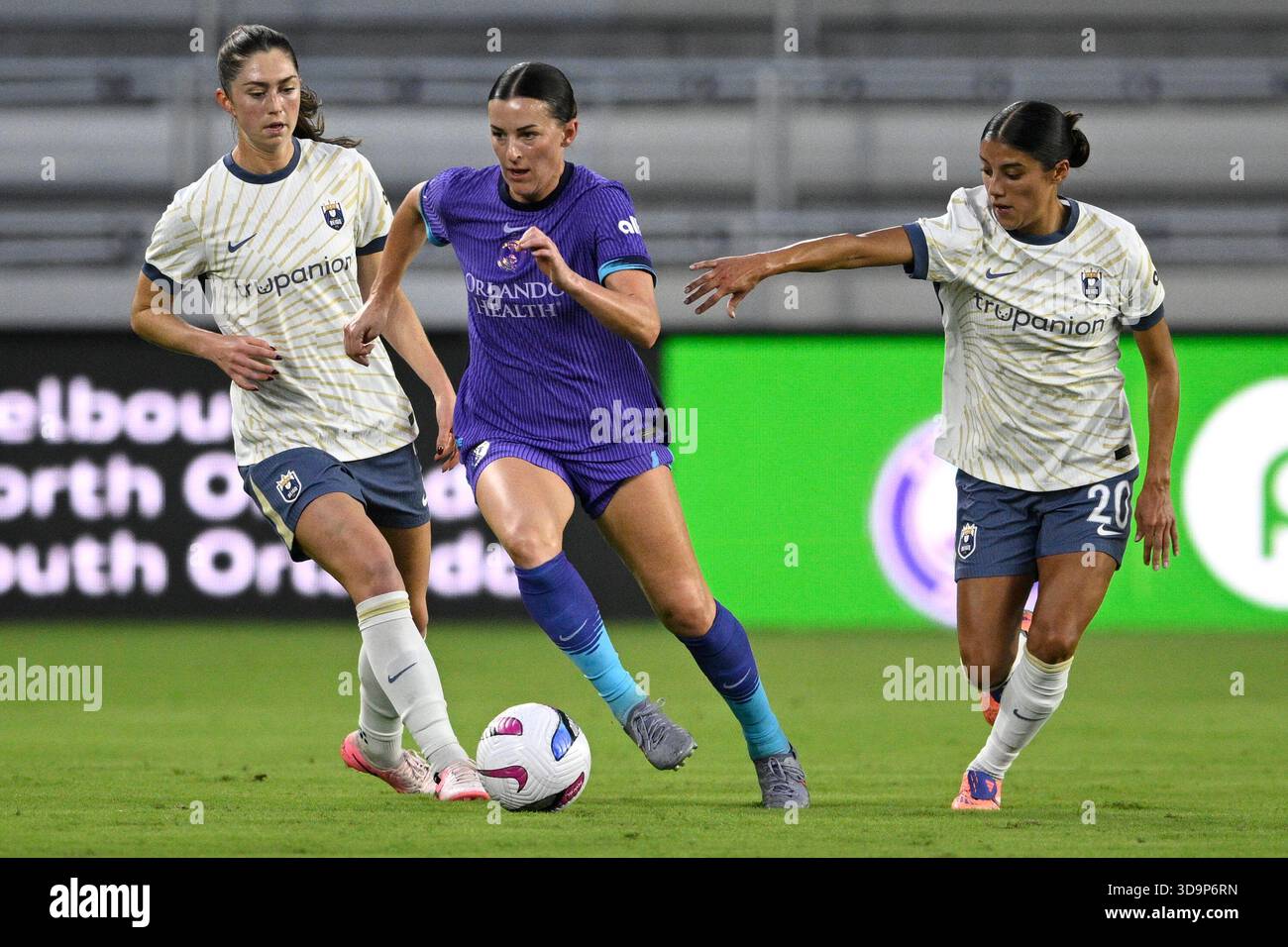 Orlando Pride midfielder Haley McCutcheon, center, controls the ball ...