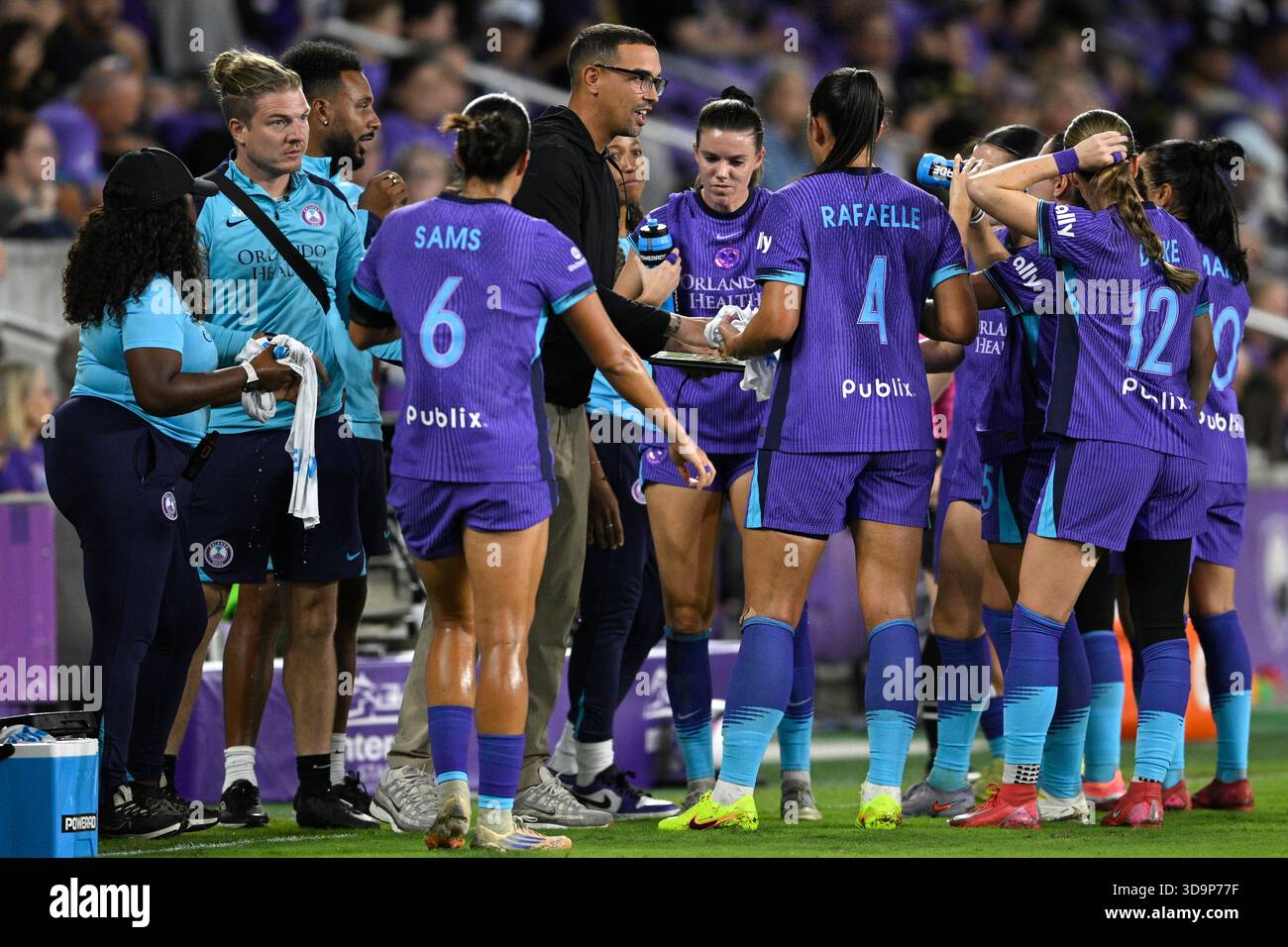 Orlando Pride head coach Seb Hines, center, talks to the team during a ...