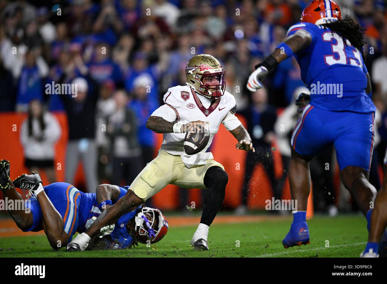Florida State quarterback Tommy Castellanos (1) is pressured by Florida ...