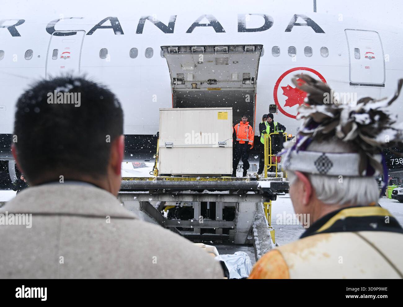 Representatives from various First Nations look on as ground crew ...