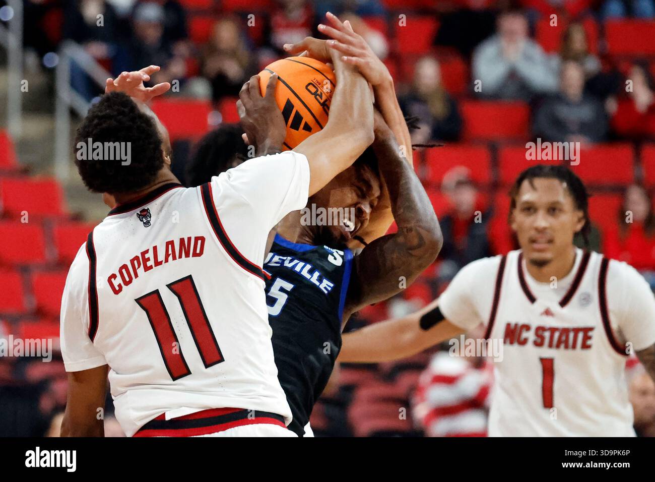 North Carolina-Asheville's Myles Mayfield (5) tussles with North ...