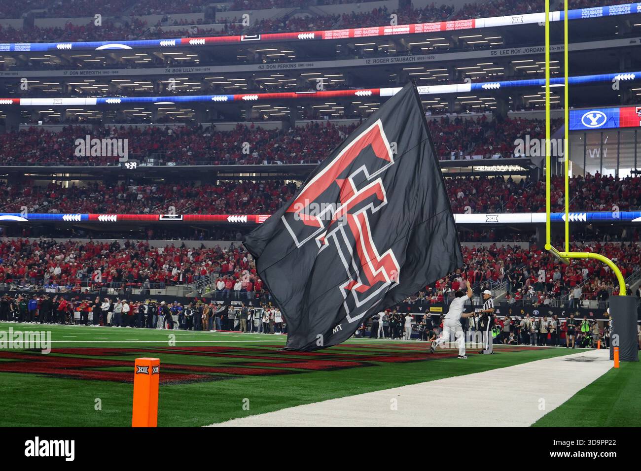 ARLINGTON, TX - DECEMBER 06: A large Texas Tech flag is run across the ...