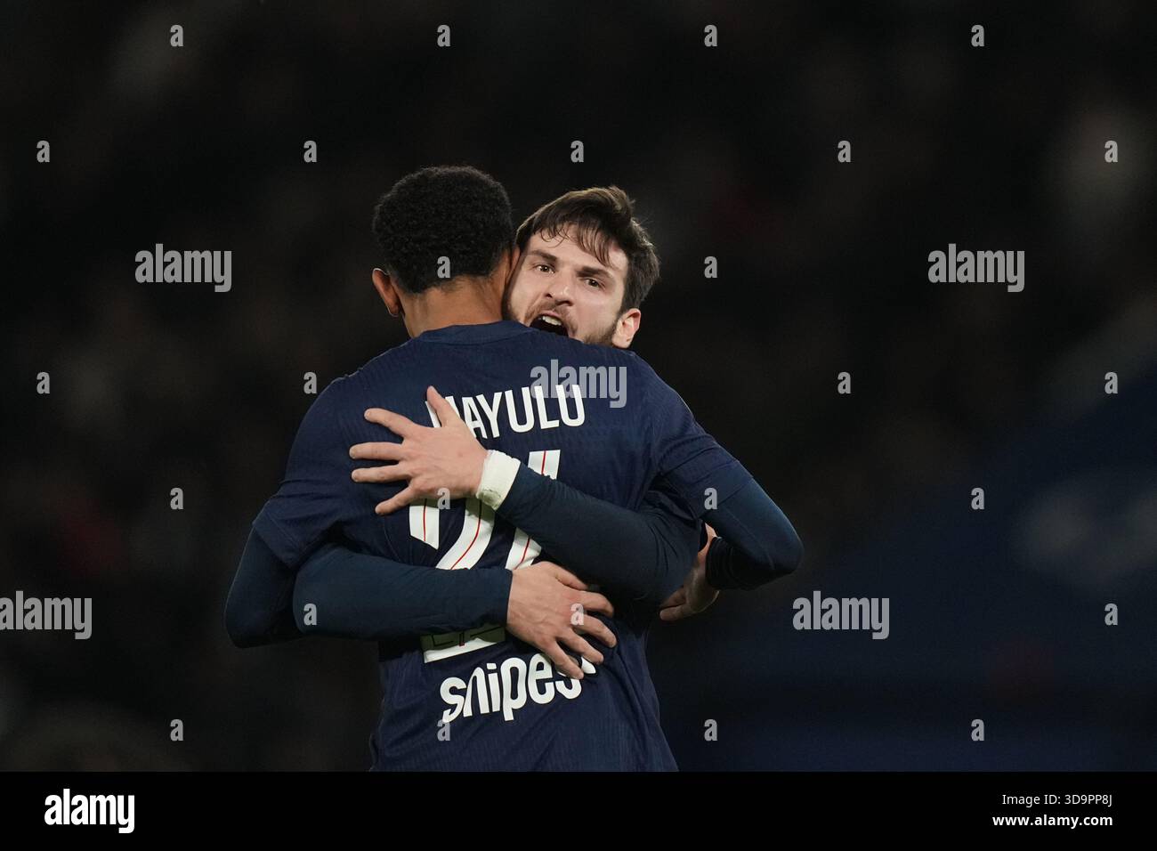 PSG's Khvicha Kvaratskhelia, background, celebrates after scoring his ...