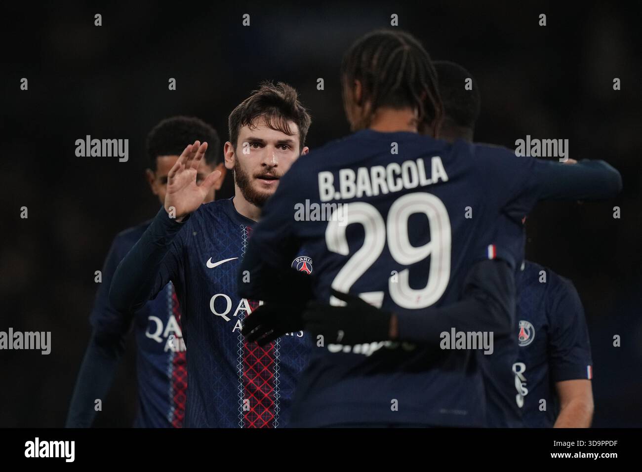 PSG's Khvicha Kvaratskhelia, center left, celebrates after scoring his ...