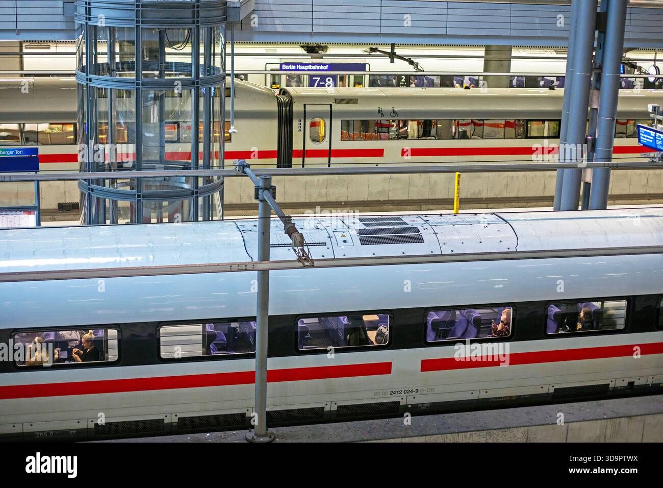 Trains and electric trains at a German railway station. Traveling in ...