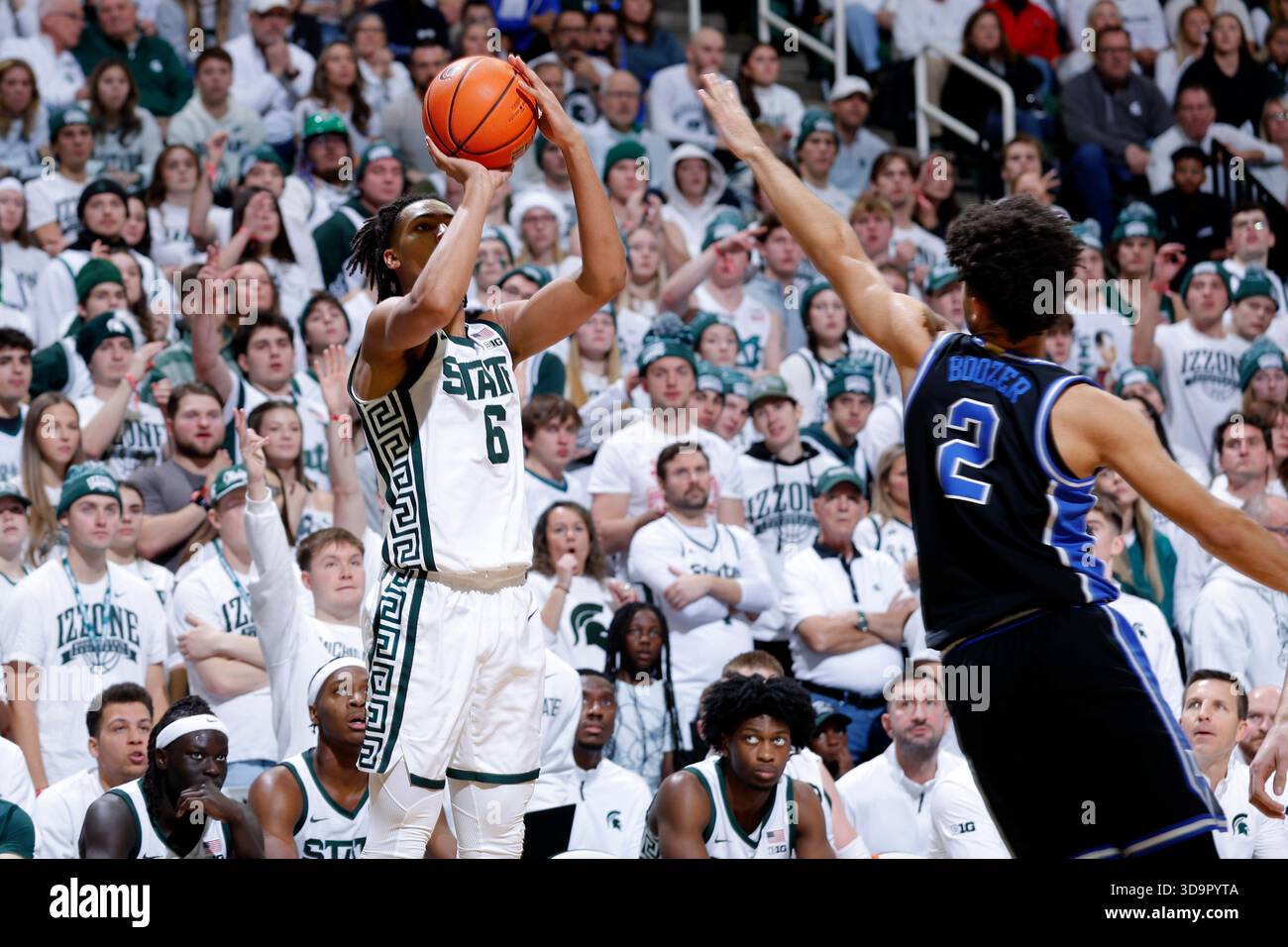 Michigan State forward Jordan Scott (6) shoots against Duke guard ...