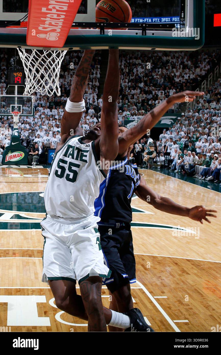 Michigan State forward Coen Carr (55) shoots against Duke guard Caleb ...