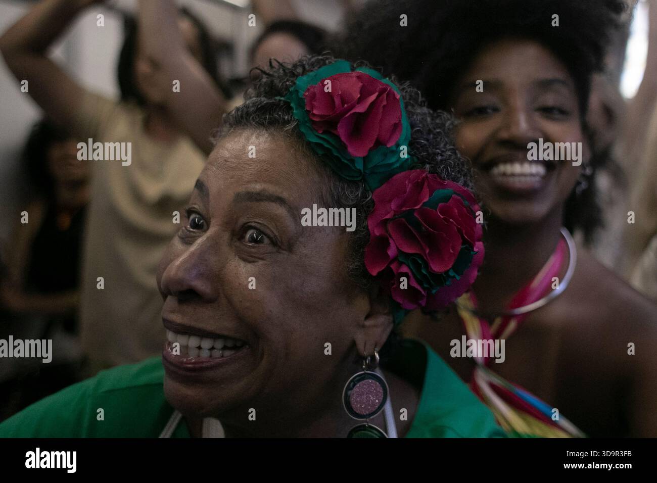 Women smile while riding the Samba Train as it winds its way through ...