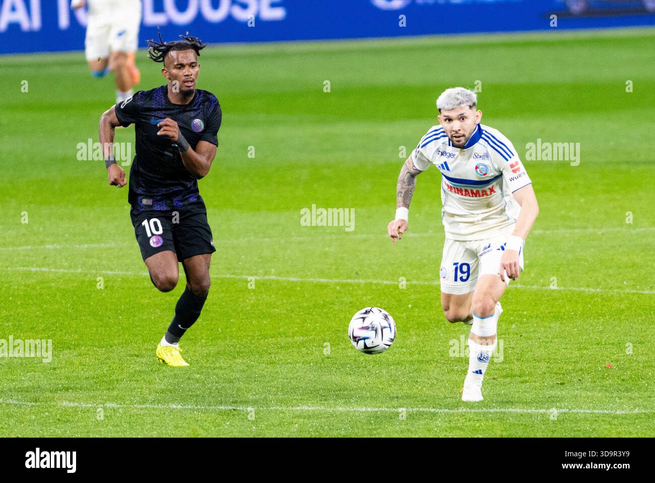 Yann Gboho of Toulouse and Julio Enciso Espinola of Strasbourg during ...