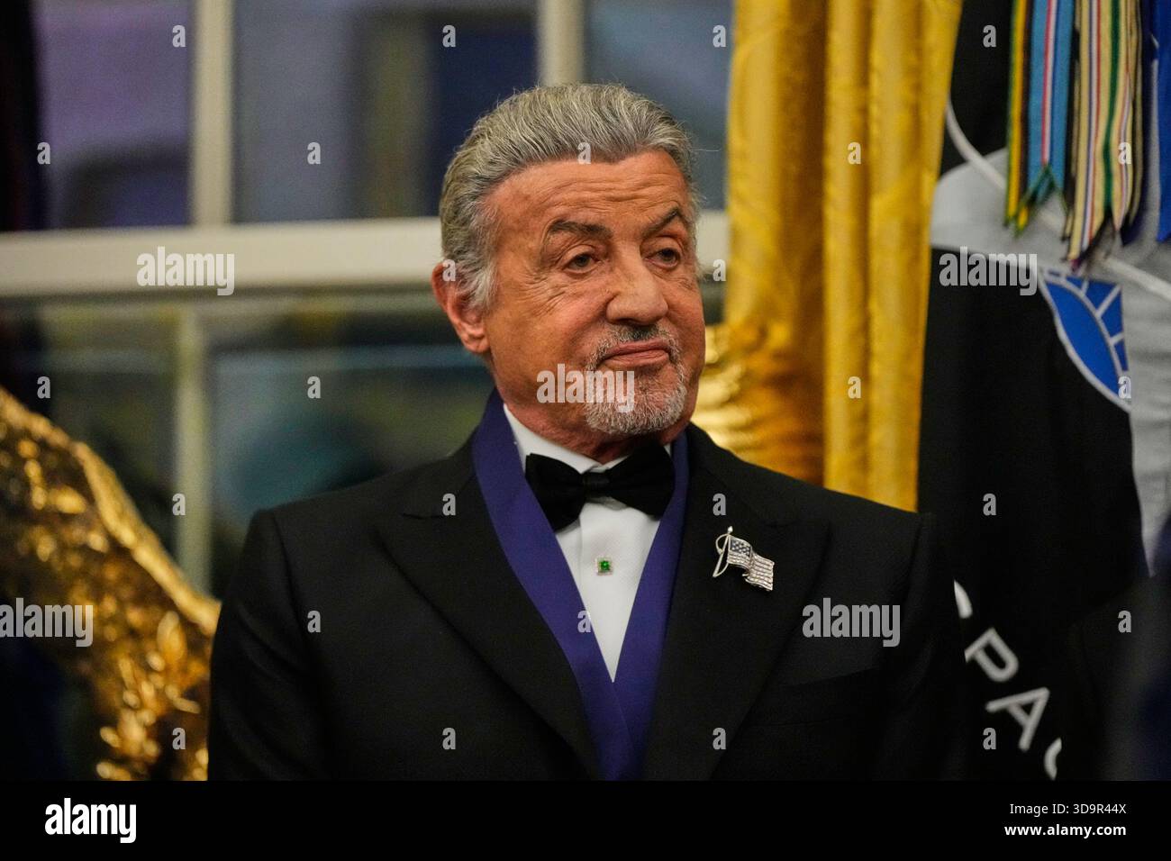 Sylvester Stallone looks on after President Donald Trump, foreground ...