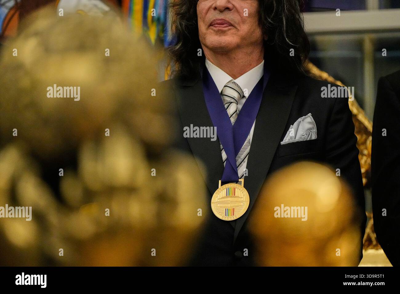 Paul Stanley, a member of the band Kiss, looks on wearing his Kennedy ...