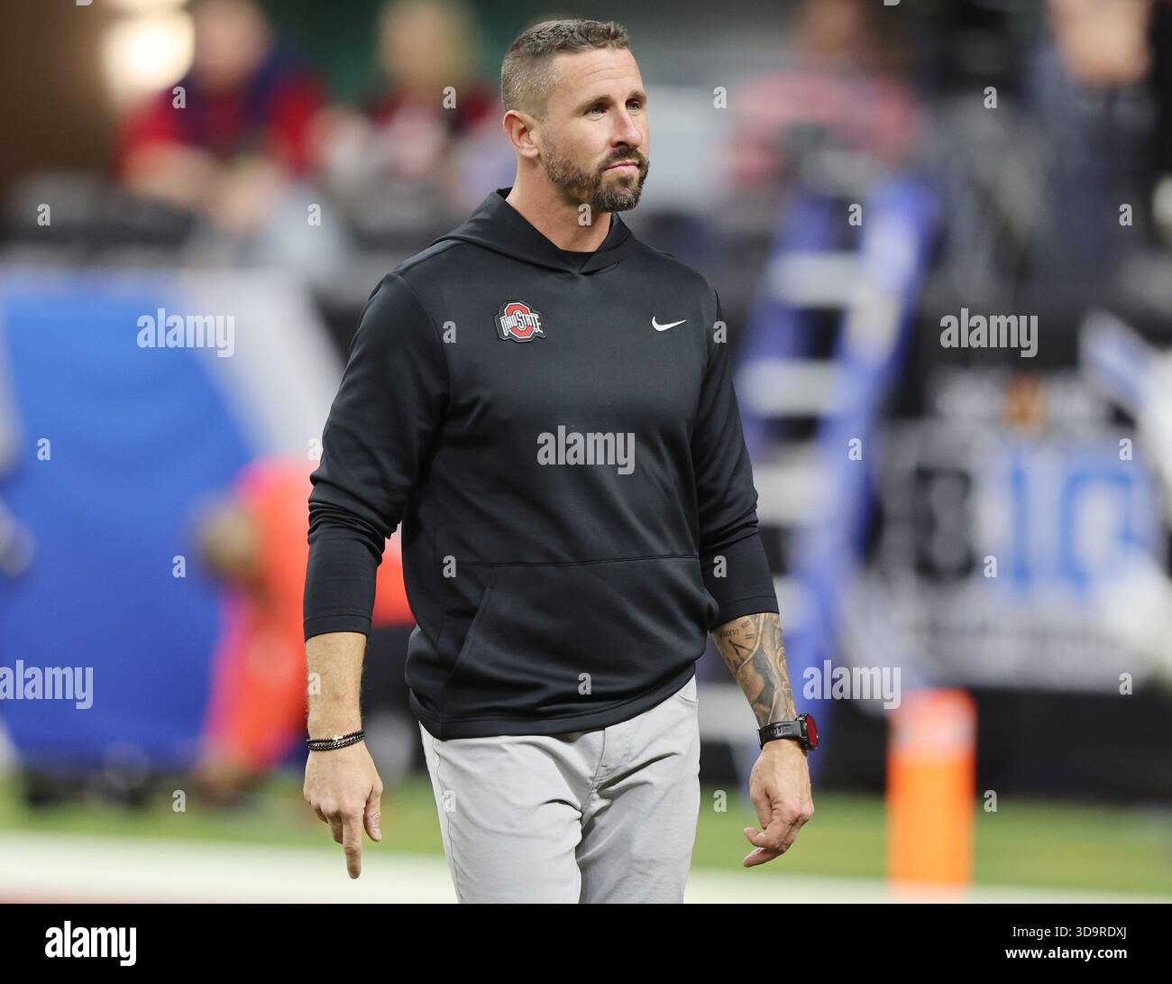 Ohio State offensive coordinator Brian Hartline watches his team before ...