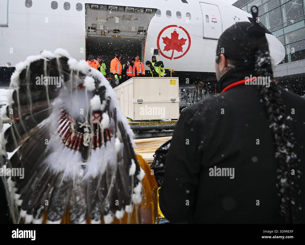 Representatives from various First Nations look on as a kayak and other ...