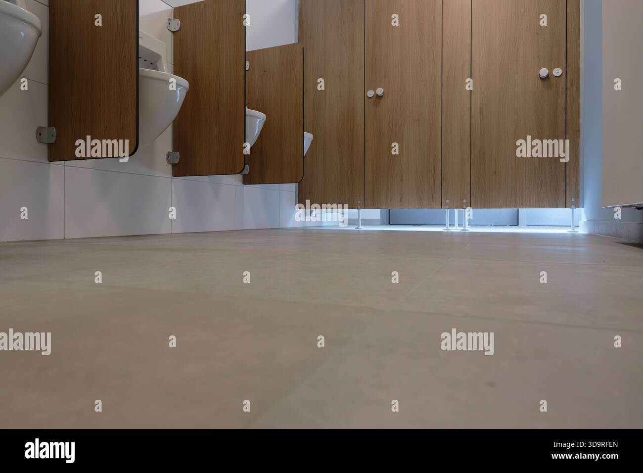 A modern, public men's restroom with high-quality privacy screens made ...