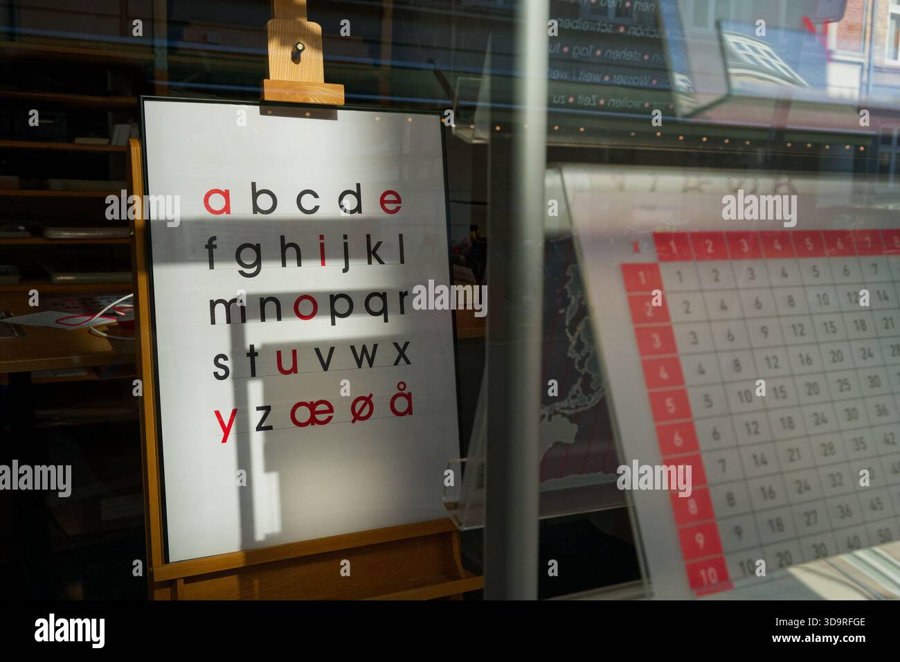 Letter board with the Danish letters of the alphabet behind a shop ...