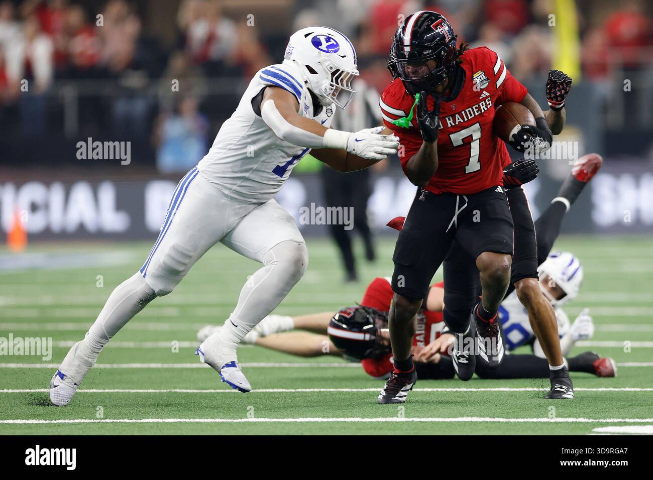Texas Tech tight end Terrance Carter (right) runs after recovering a ...