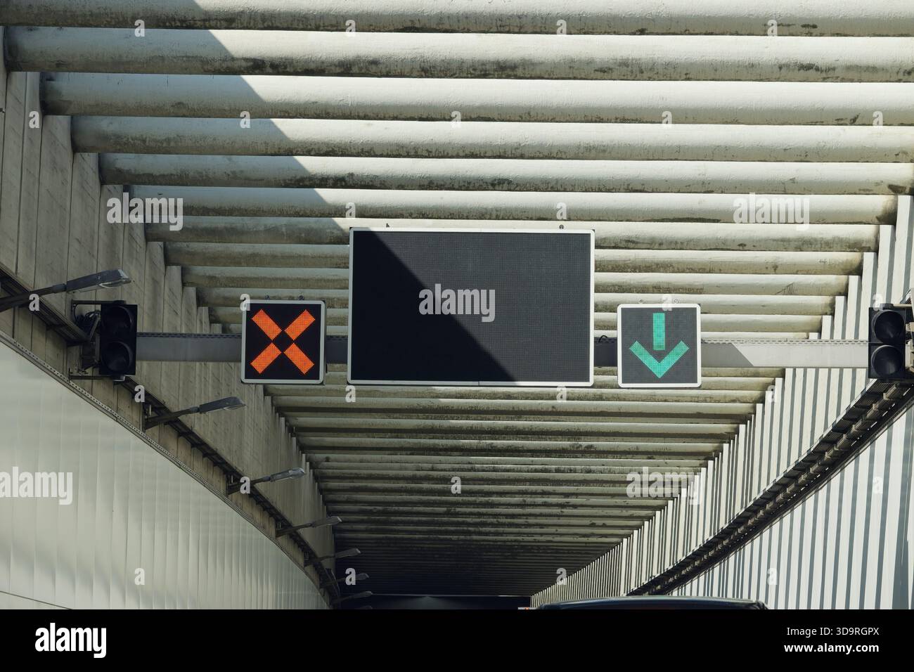 Traffic control signals in a tunnel Elbtunnel at A7 featuring a red X ...