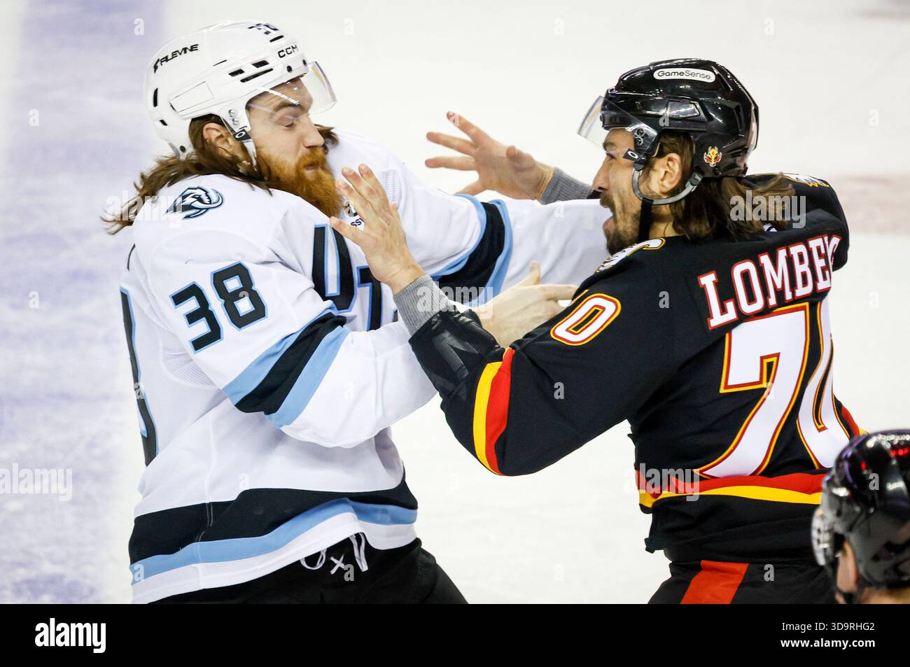 Utah Mammoth's Liam O'Brien, left, and Calgary Flames' Ryan Lomberg ...