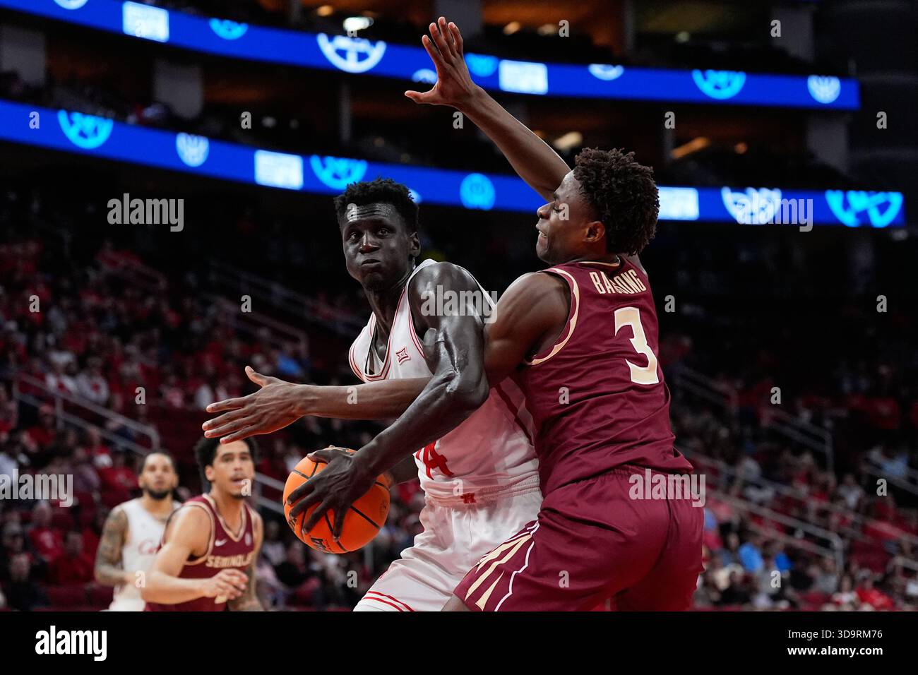 Florida State guard Thomas Bassong (3) fouls Houston forward Kalifa ...