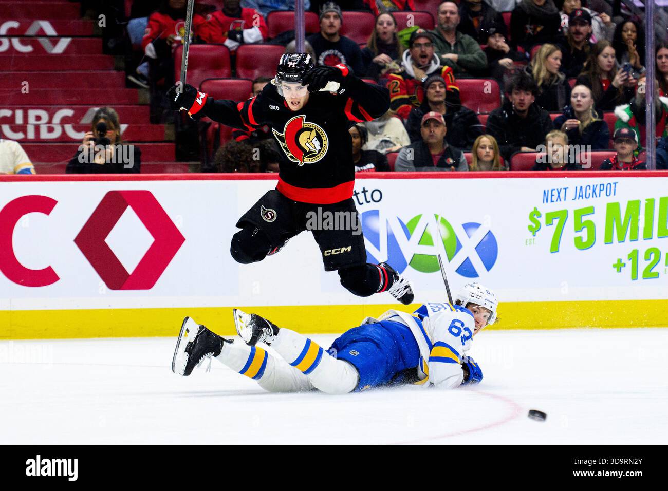 Ottawa Senators' Ridly Greig (71) leaps over St. Louis Blues' Jake ...