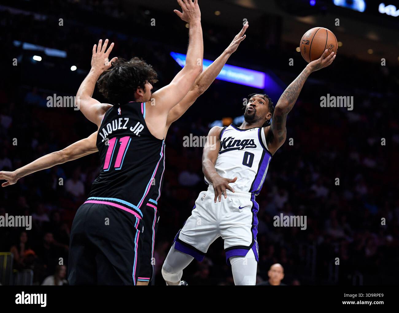 Sacramento Kings guard Malik Monk looks to shoot over Miami Heat guard ...