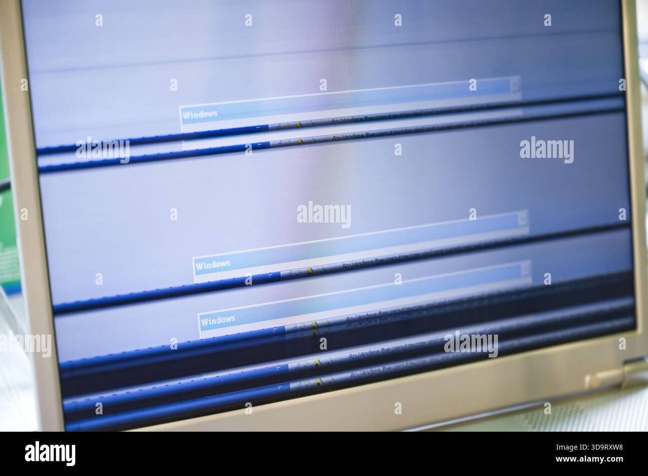 A close-up of a computer monitor displaying a distorted screen with ...