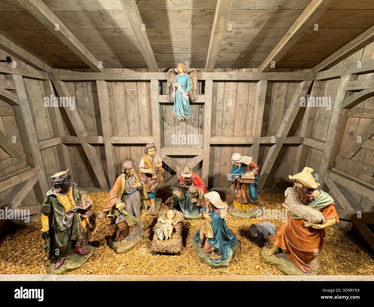 A nativity scene featuring intricately detailed figurines of Mary ...