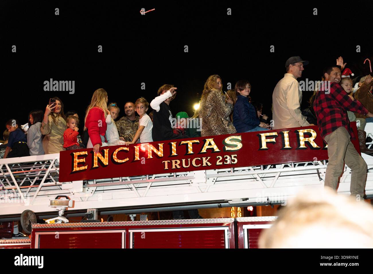 December 6, 2025, Encinitas, California, USA: People stand atop a fire ...