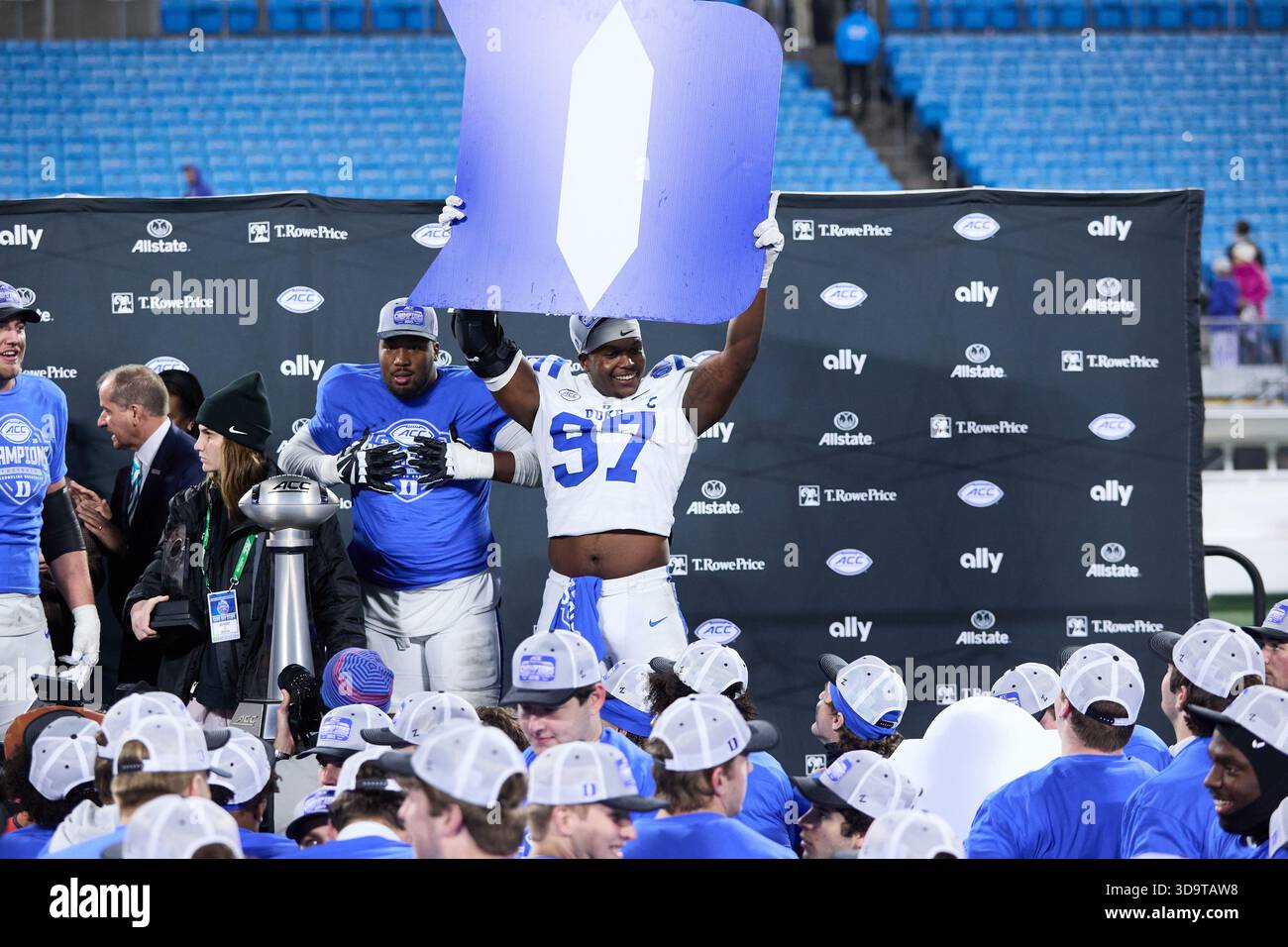 Duke Blue Devils defensive end Wesley Williams (97) holds up a Duke ...