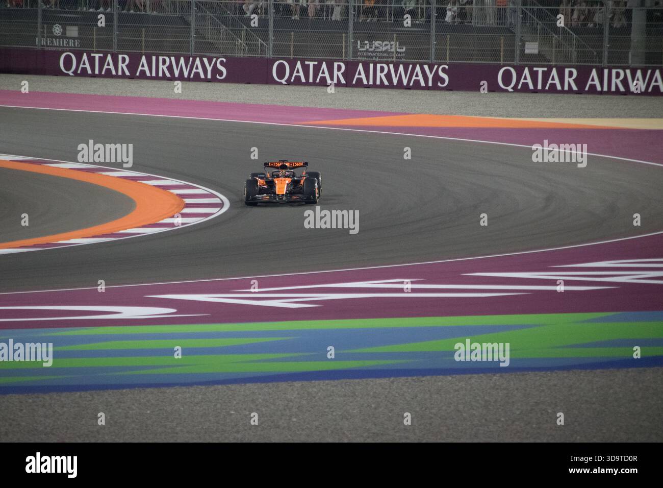 Race car speeds around track at the Formula 1 2025 Qatar Grand Prix in ...