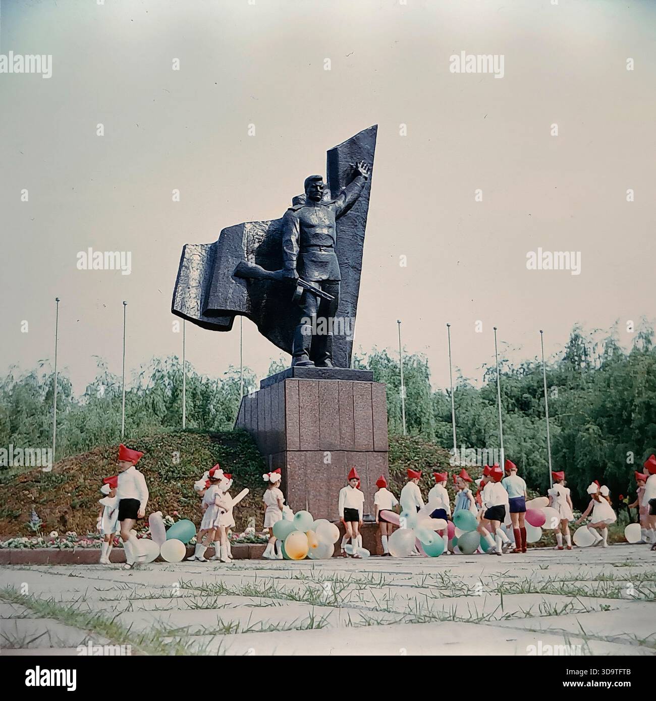 A vintage archival color photograph capturing a group of children ...