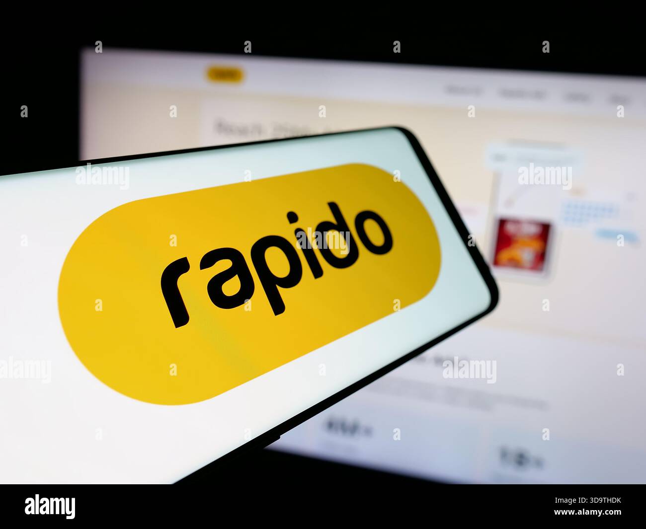 Stuttgart, Germany - 11-24-2025: Smartphone with logo of Indian ride ...