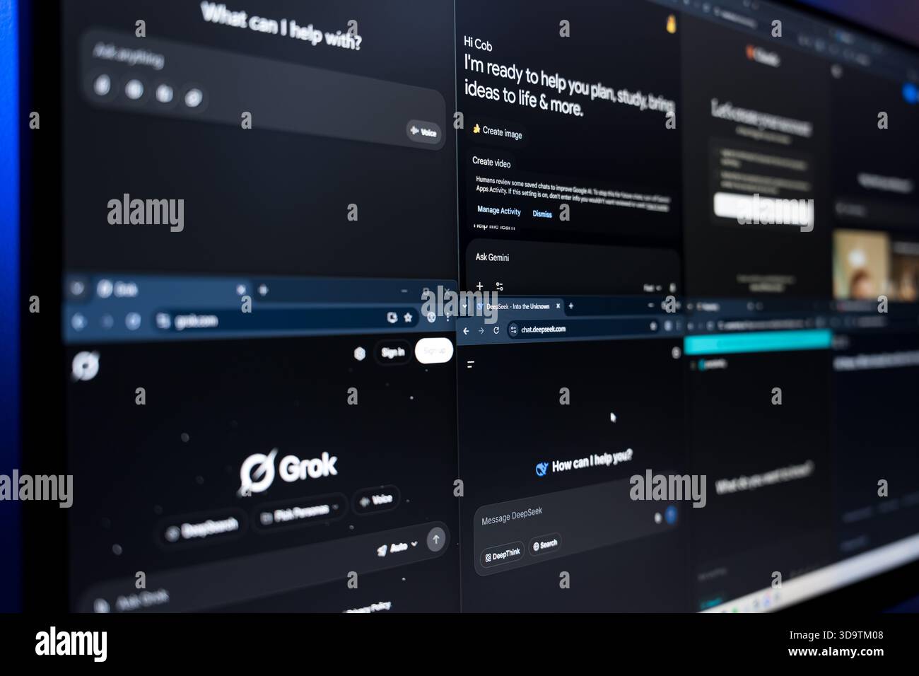 Monitor Screen Displaying A Grid Of Eight Major Ai Chatbot Interfaces