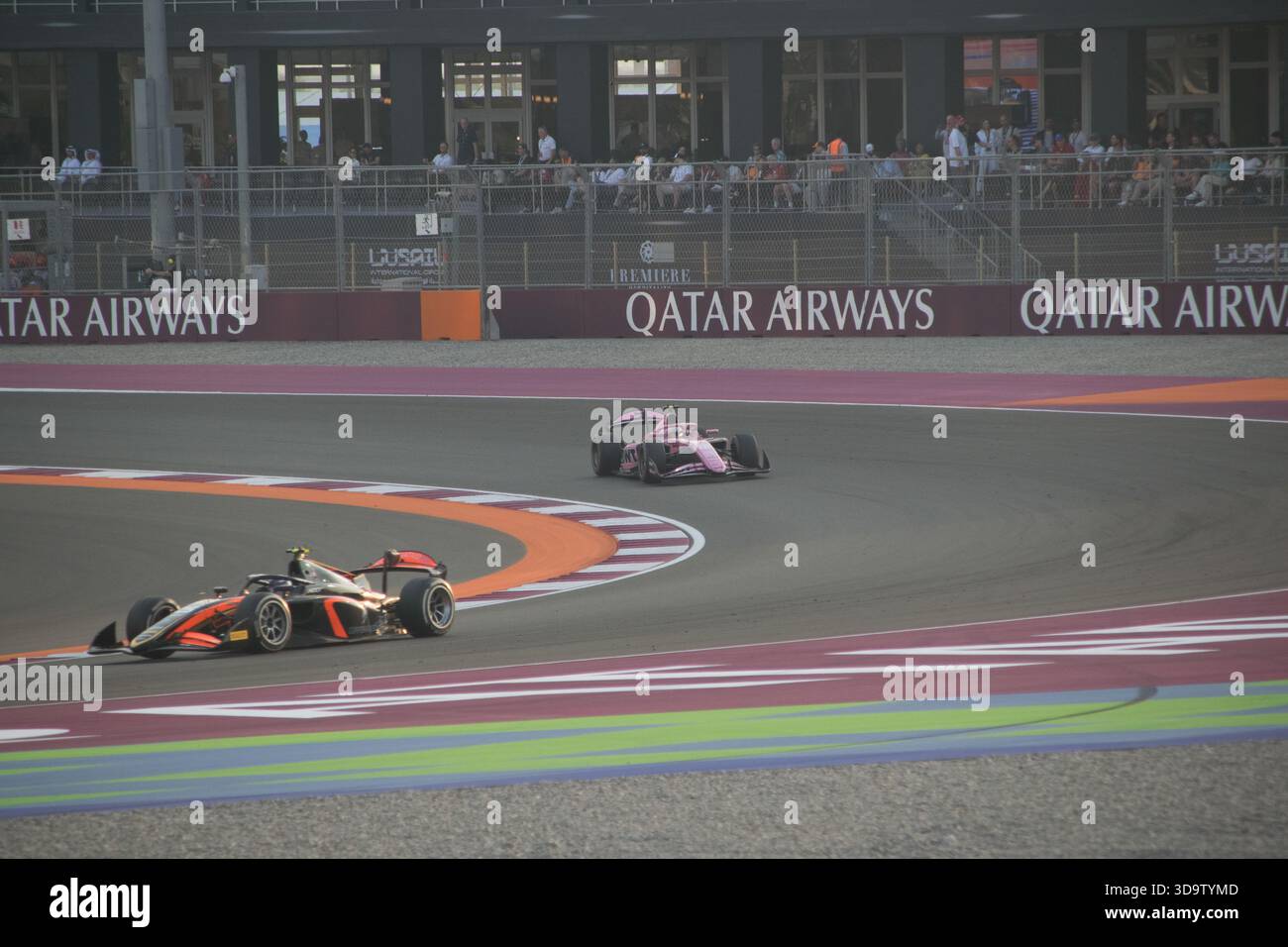 Two race cars compete closely on the circuit during Formula 1 2025 ...