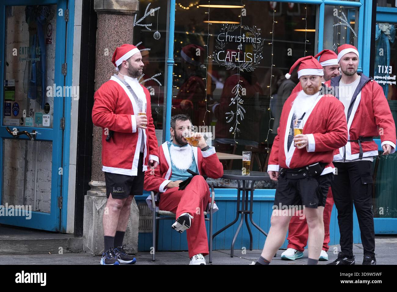 People during the Liverpool Santa Dash in Liverpool. Picture date ...