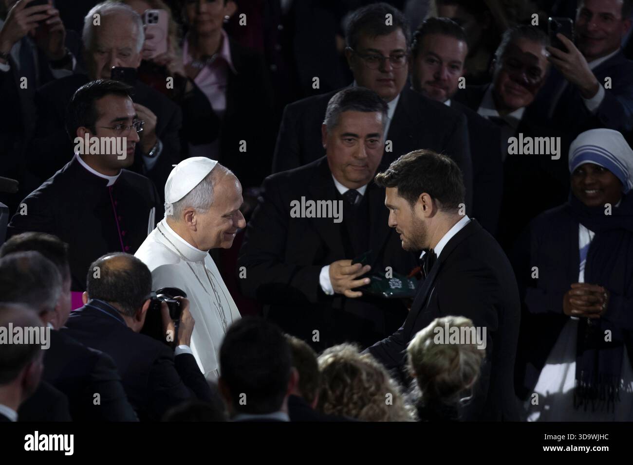 Vatican City, Vatican. 06th Dec, 2025. Pope Leo XIV greets singer ...