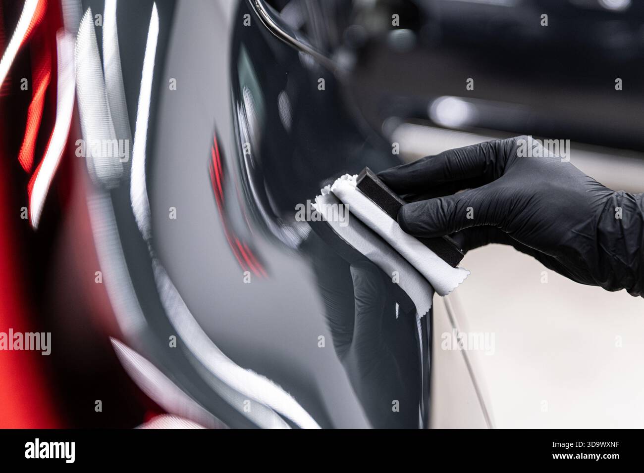 Ceramic coating application on car paint using applicator pad during ...