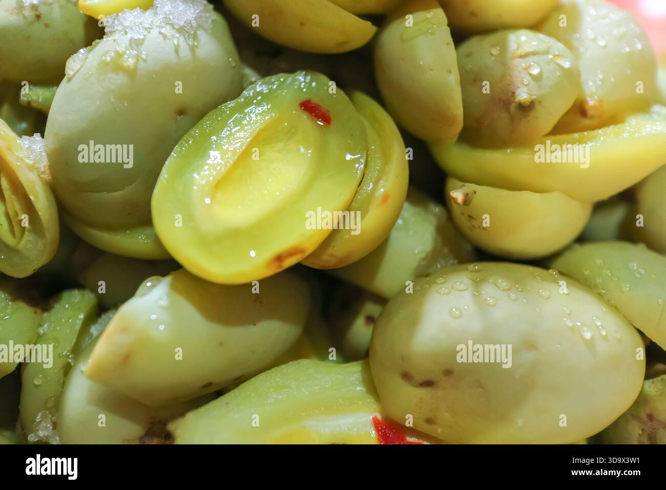 Macro of spicy pickled Thai olives with chili. Authentic Asian street ...