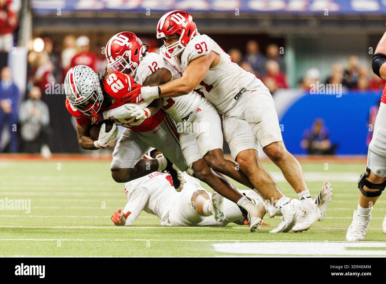 December 06, 2025: Indiana defensive back Devan Boykin (12) and Indiana defensive lineman Mario ...