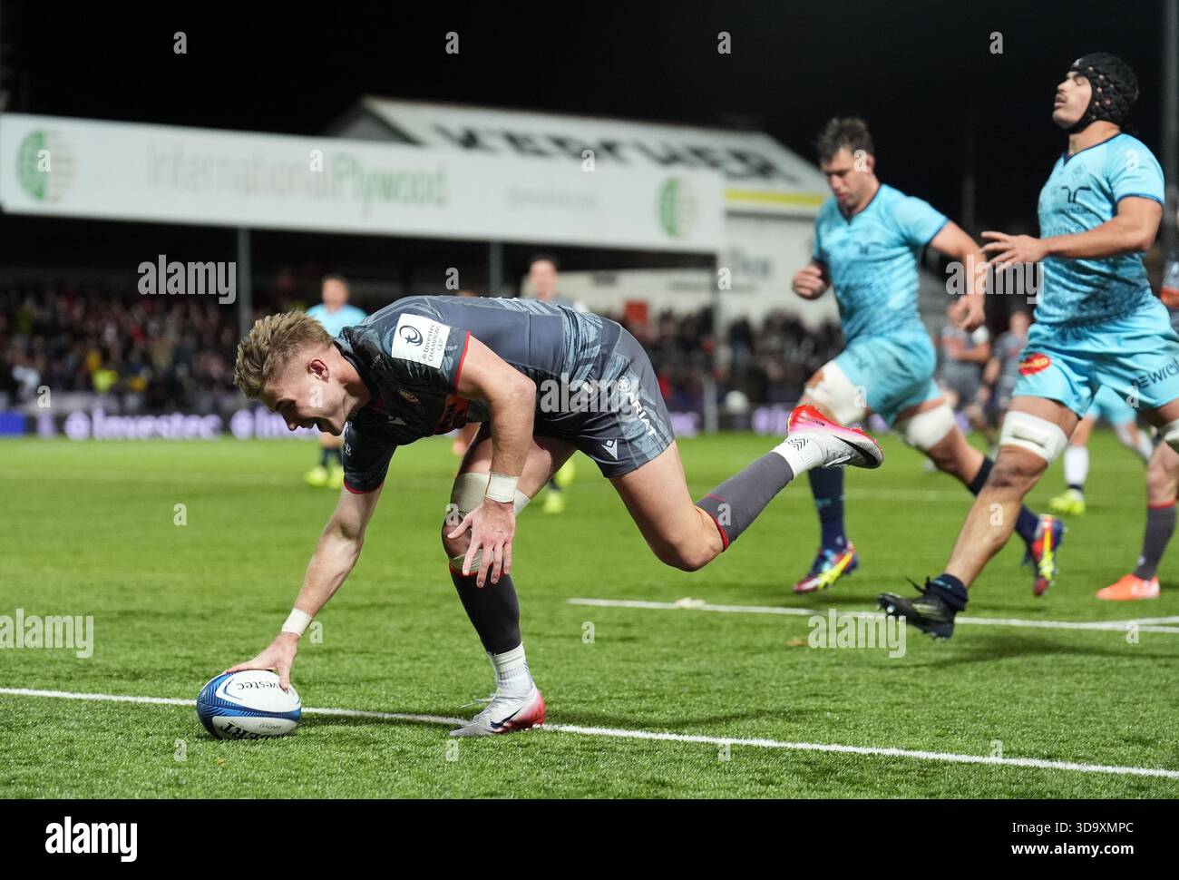 Gloucester Rugby's Charlie Atkinson (left) scores a try during the ...
