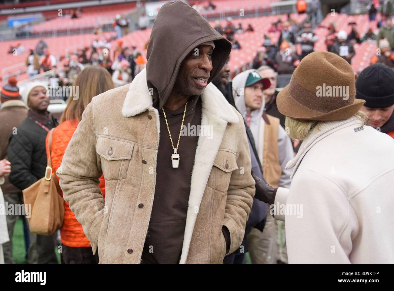 Deion Sanders, left, talks with Cleveland Browns part owner Dee Haslam ...