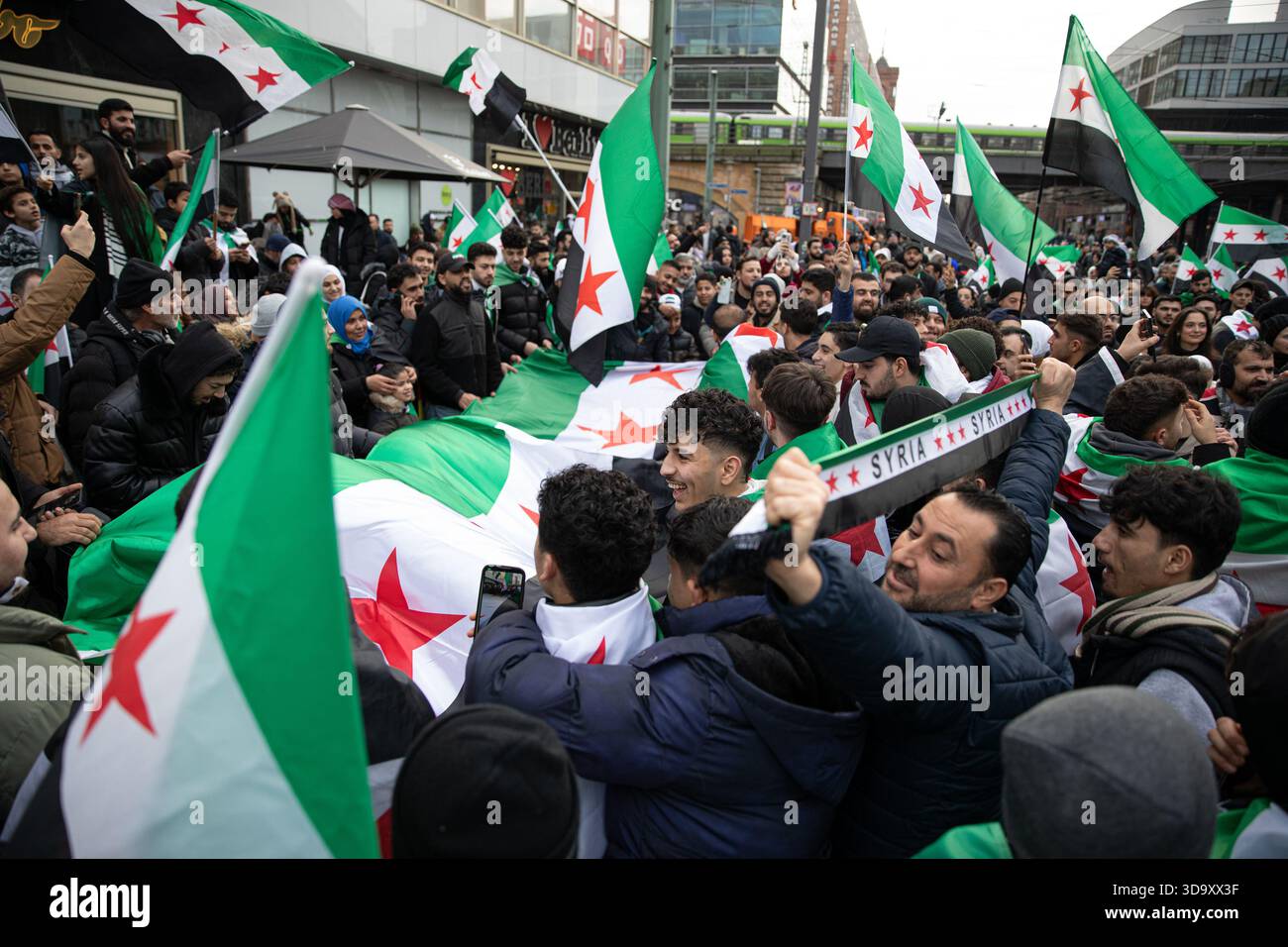 On Sunday, December 7, 2025, large crowds of Syrians gather at ...