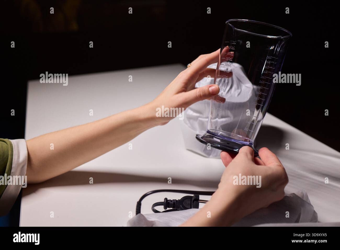 Preparing blender on kitchen counter, Scene shows detailed process of ...