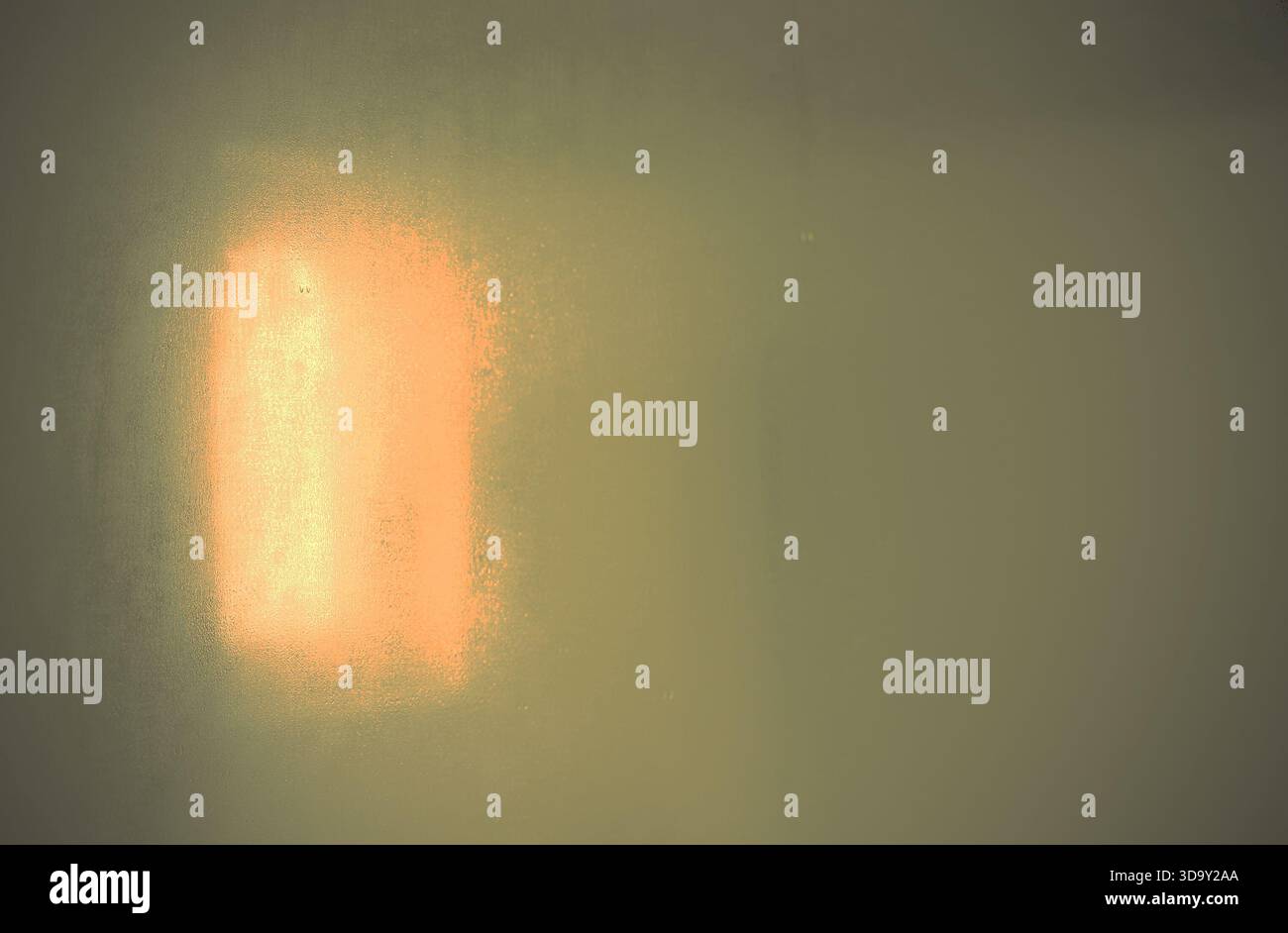 Abstract blurred light reflection on a fogged mirror creating a soft ...