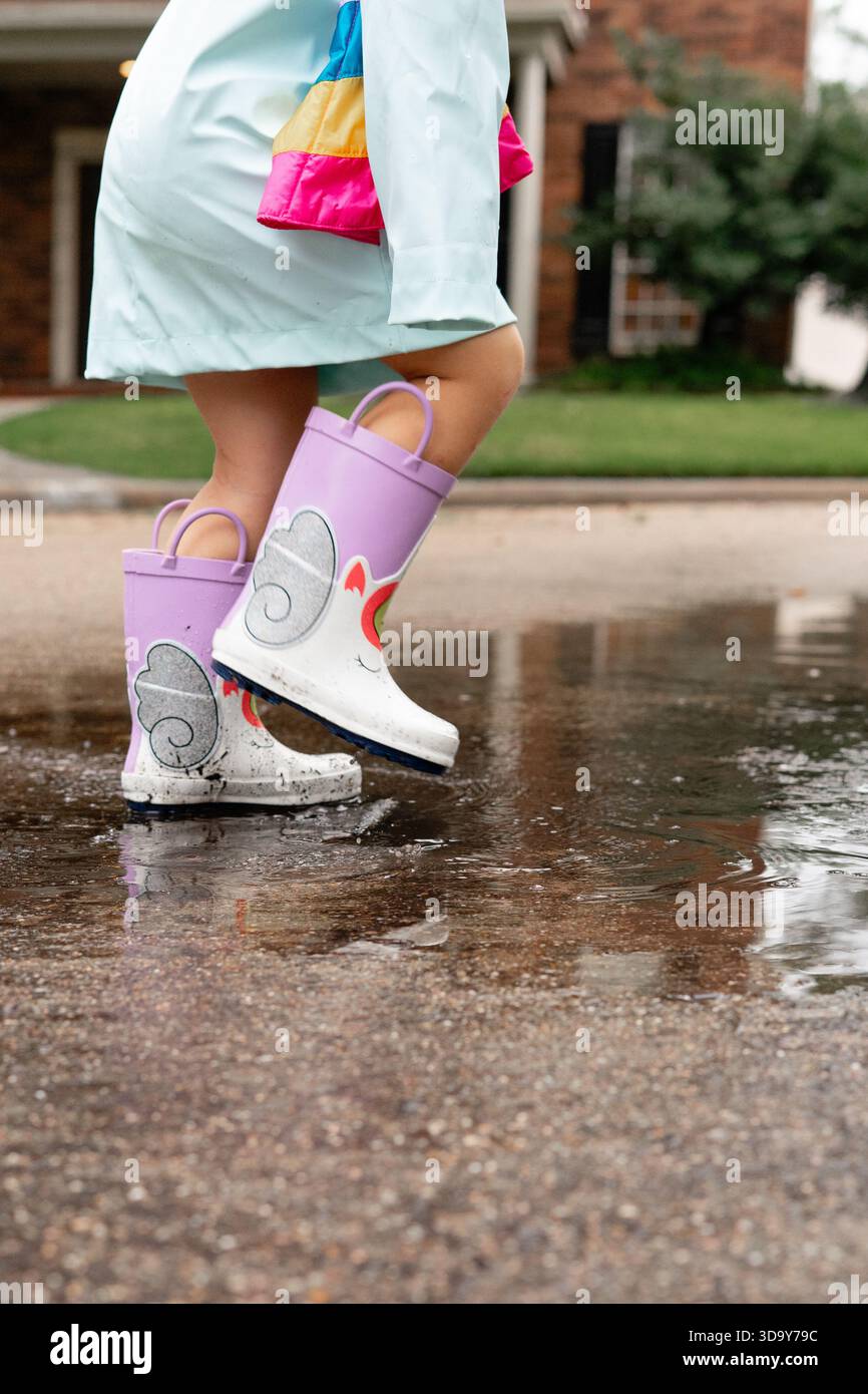 Mud flying as they jump on a wet street hi-res stock photography and ...