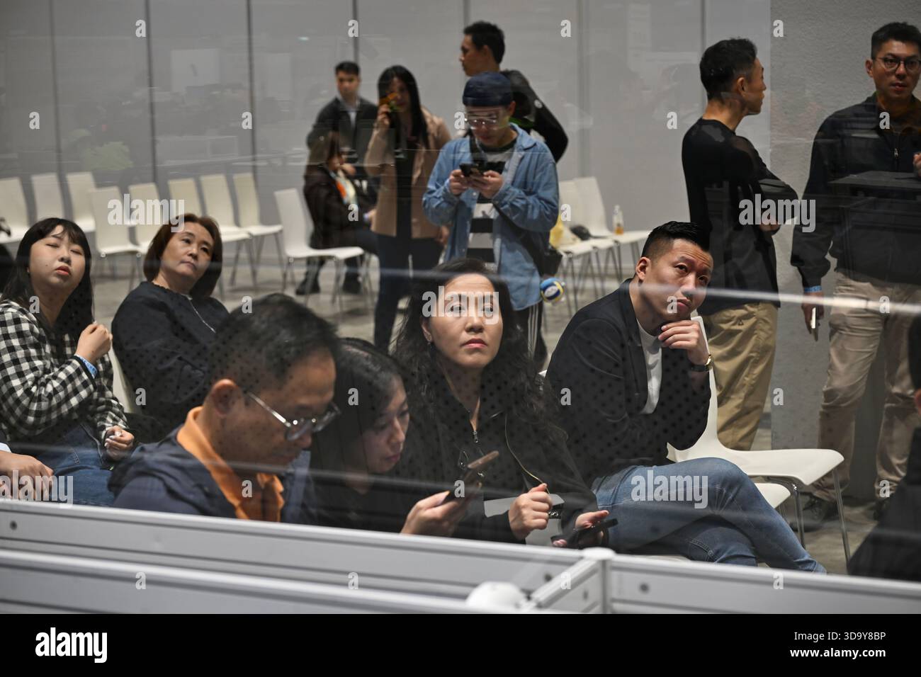 People watching the Election Committee Constituency counting on ...